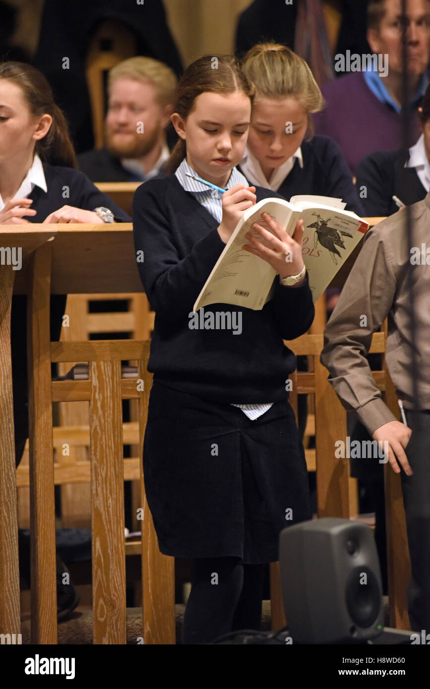 Choristers being conducted by choir master at a recording session for a ...