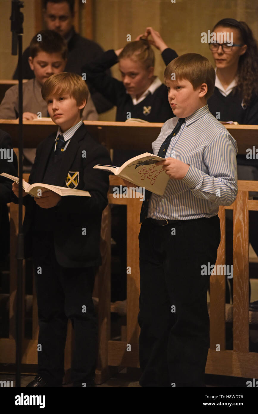 Choristers being conducted by choir master at a recording session for a ...