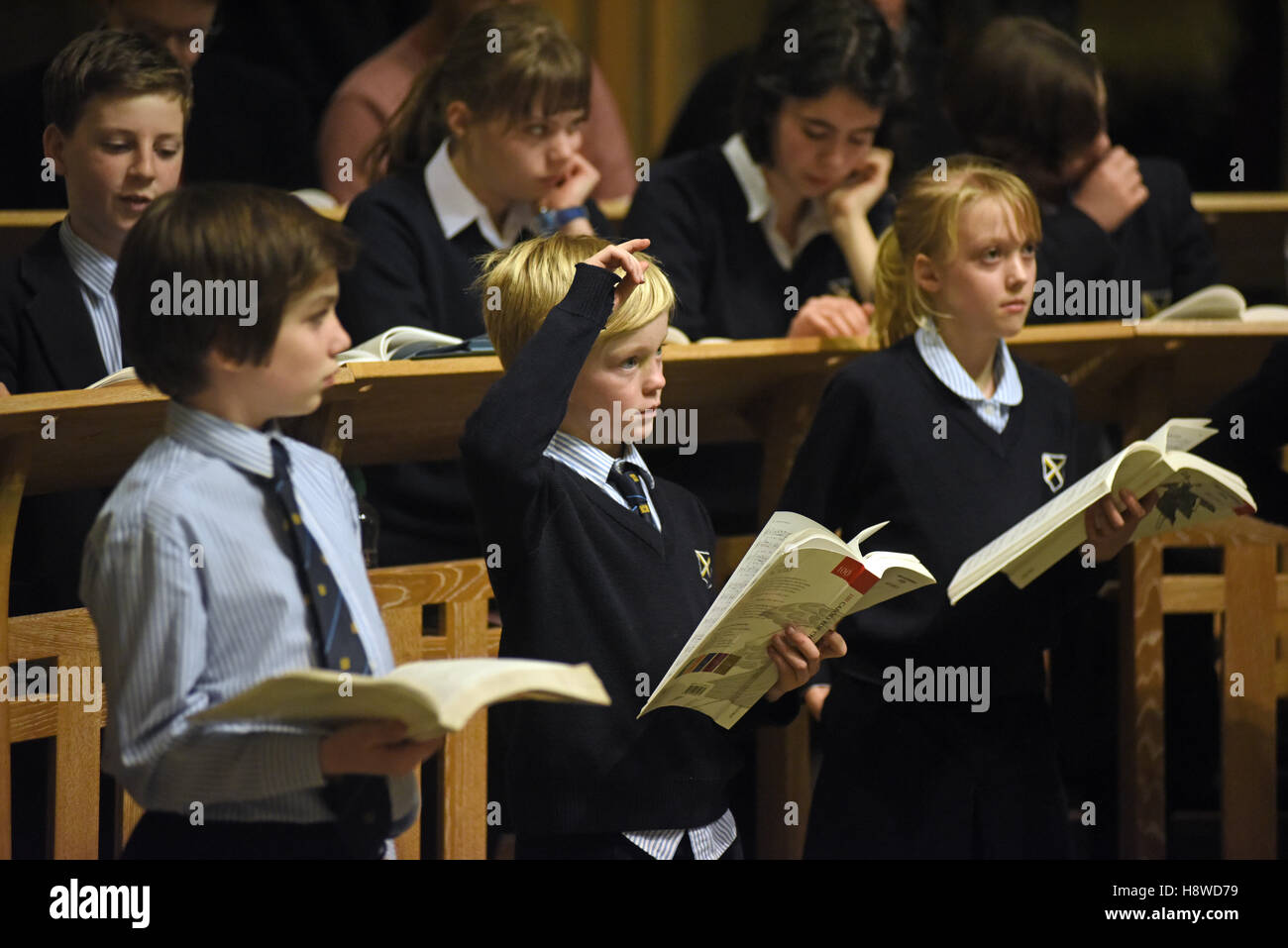 Choristers being conducted by choir master at a recording session for a ...