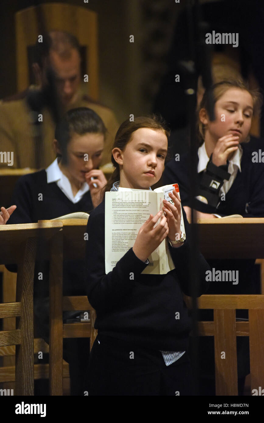 Choristers being conducted by choir master at a recording session for a ...