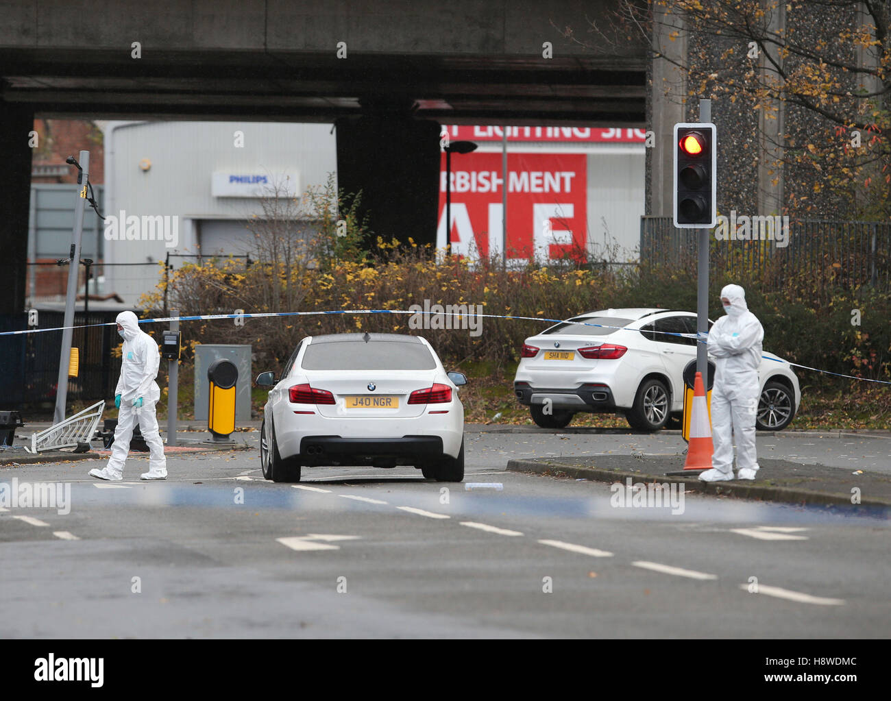 Police forensic officers at the scene where a man died after being shot ...
