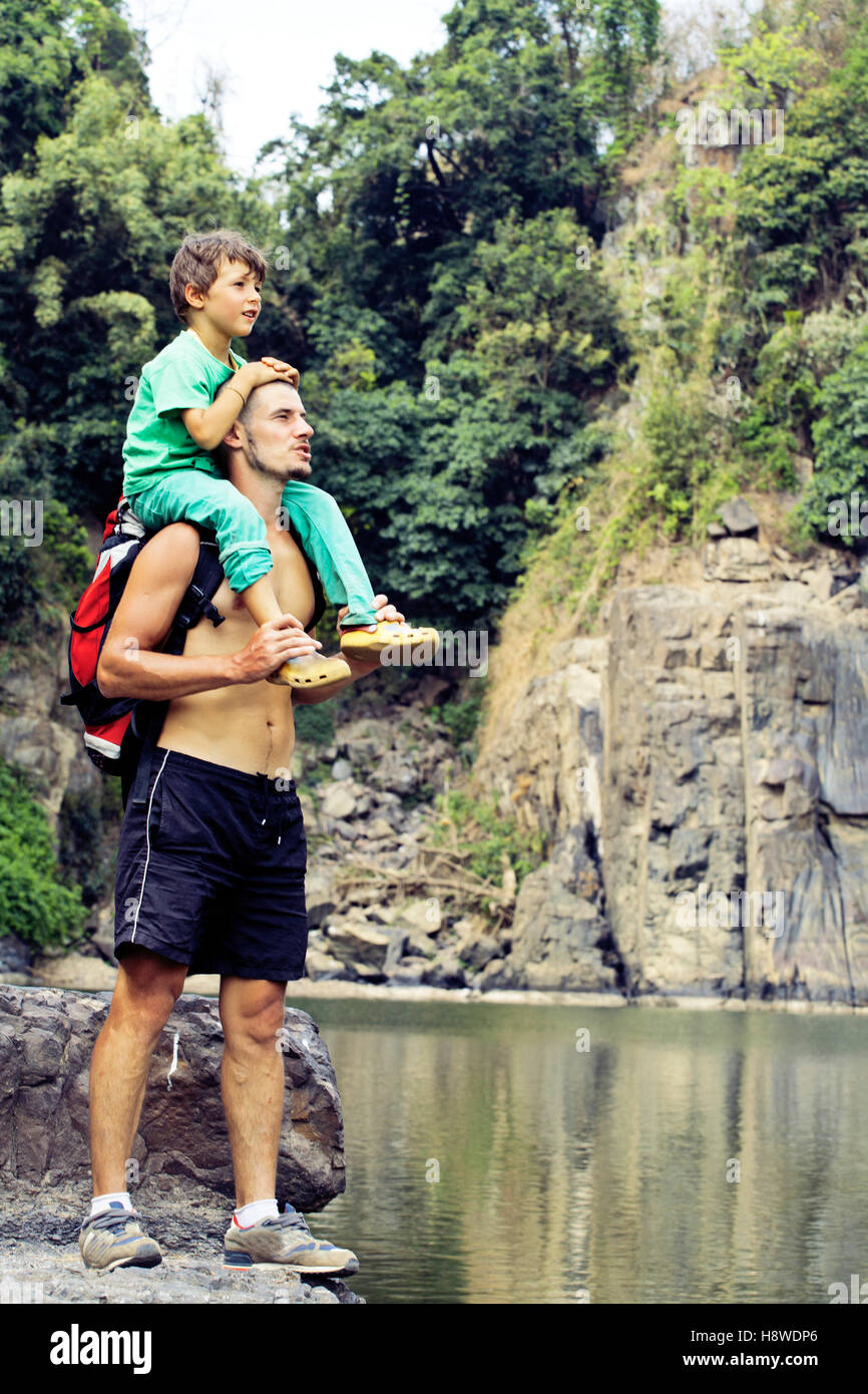 father and son making a trip to waterfall together, happy family Stock ...