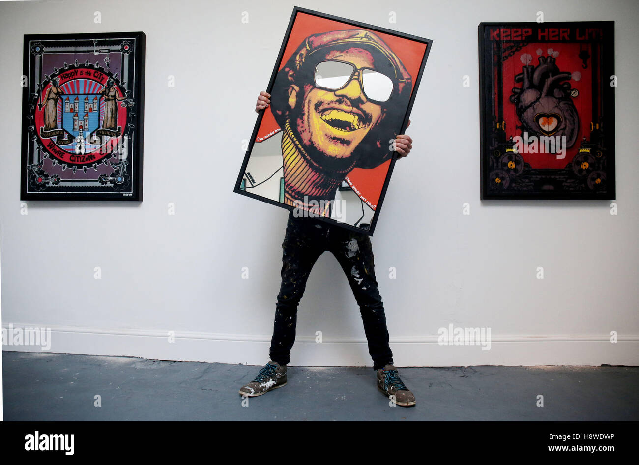 Dublin Street Artist ADW holds a piece called "Ever wonder how Stevie ...