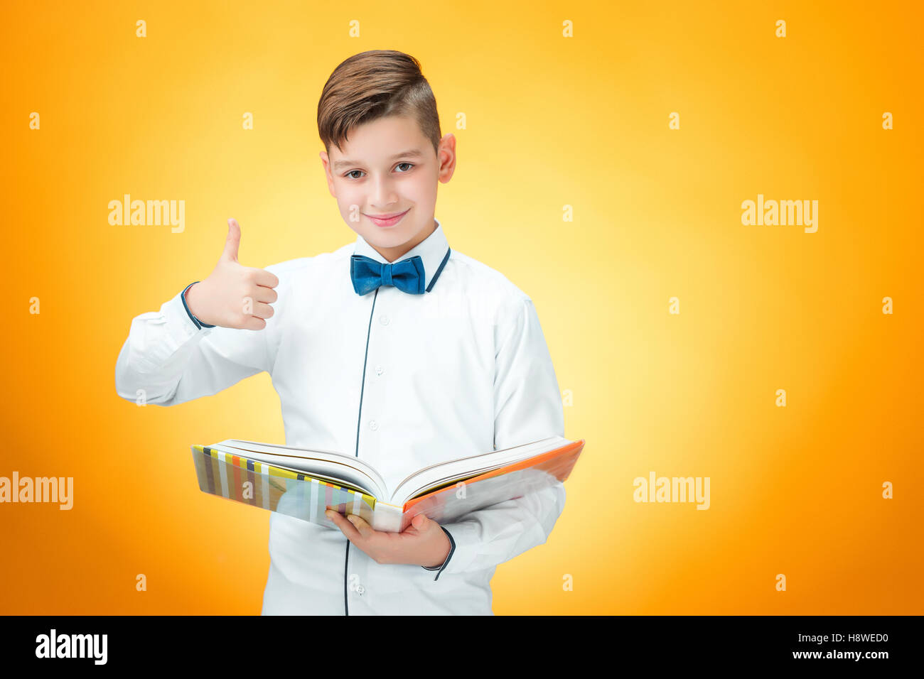 The boy with book Stock Photo - Alamy