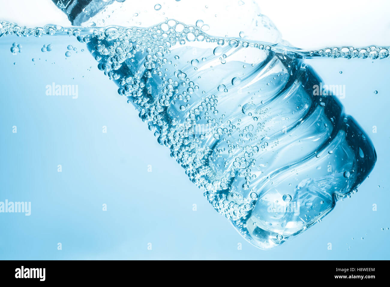 Bottle in under clean drinking water Stock Photo - Alamy