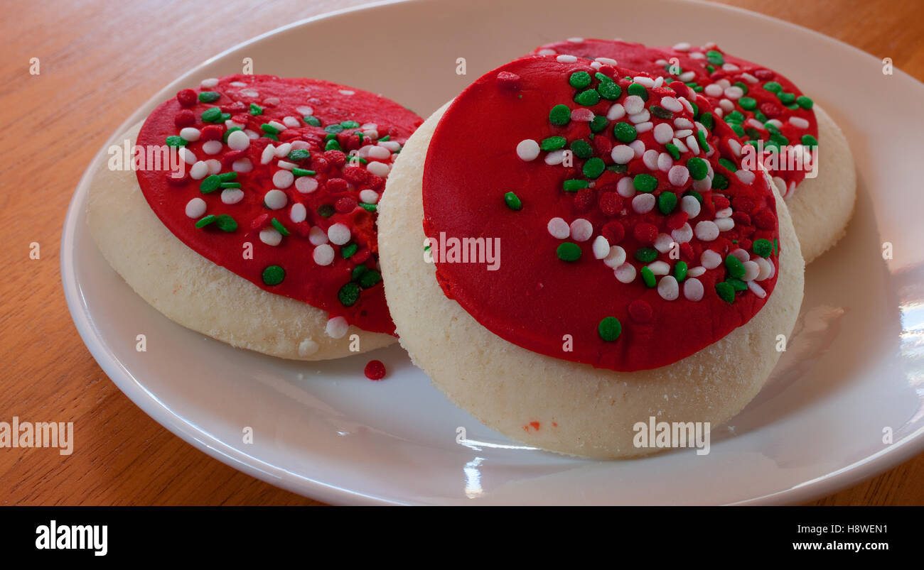 Cookies with a bright red frosting and colored sprinkles Stock Photo ...