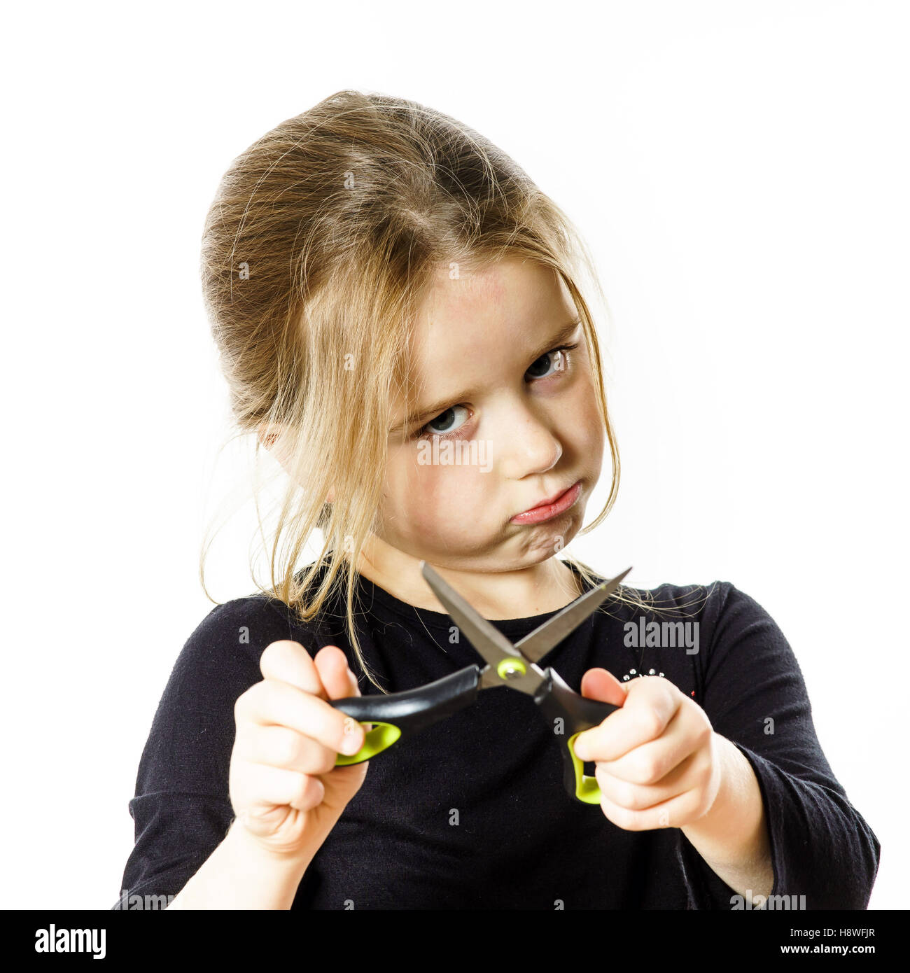 Cute little girl with scissors. Self hairdresser, isolated on white ...