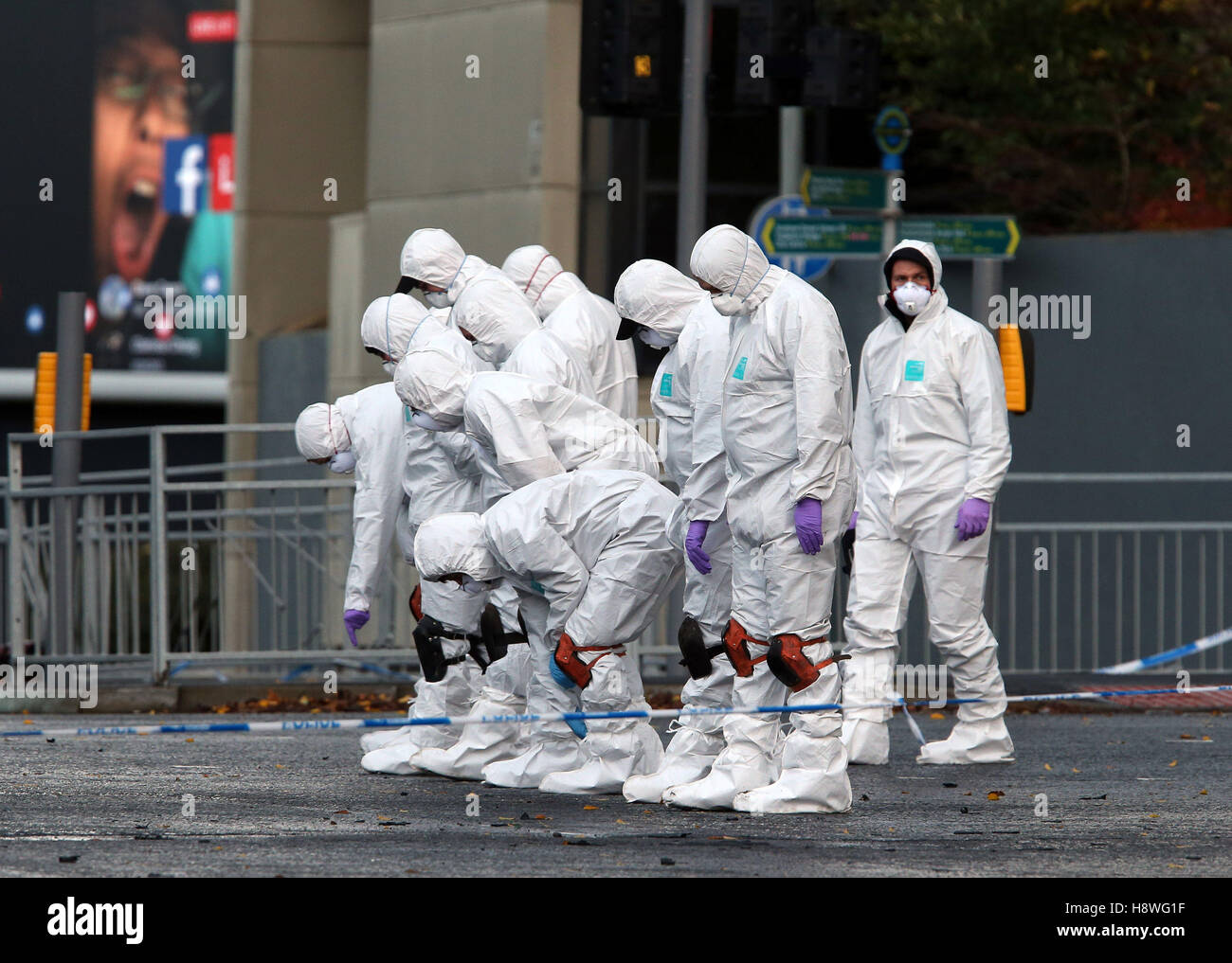 Police forensic officers at the scene where a man died after being shot ...