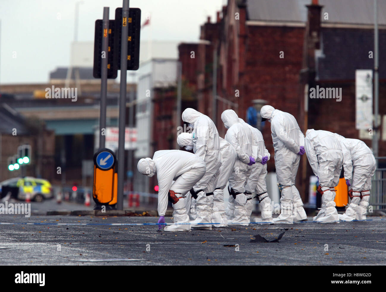 Police forensic officers at the scene where a man died after being shot ...