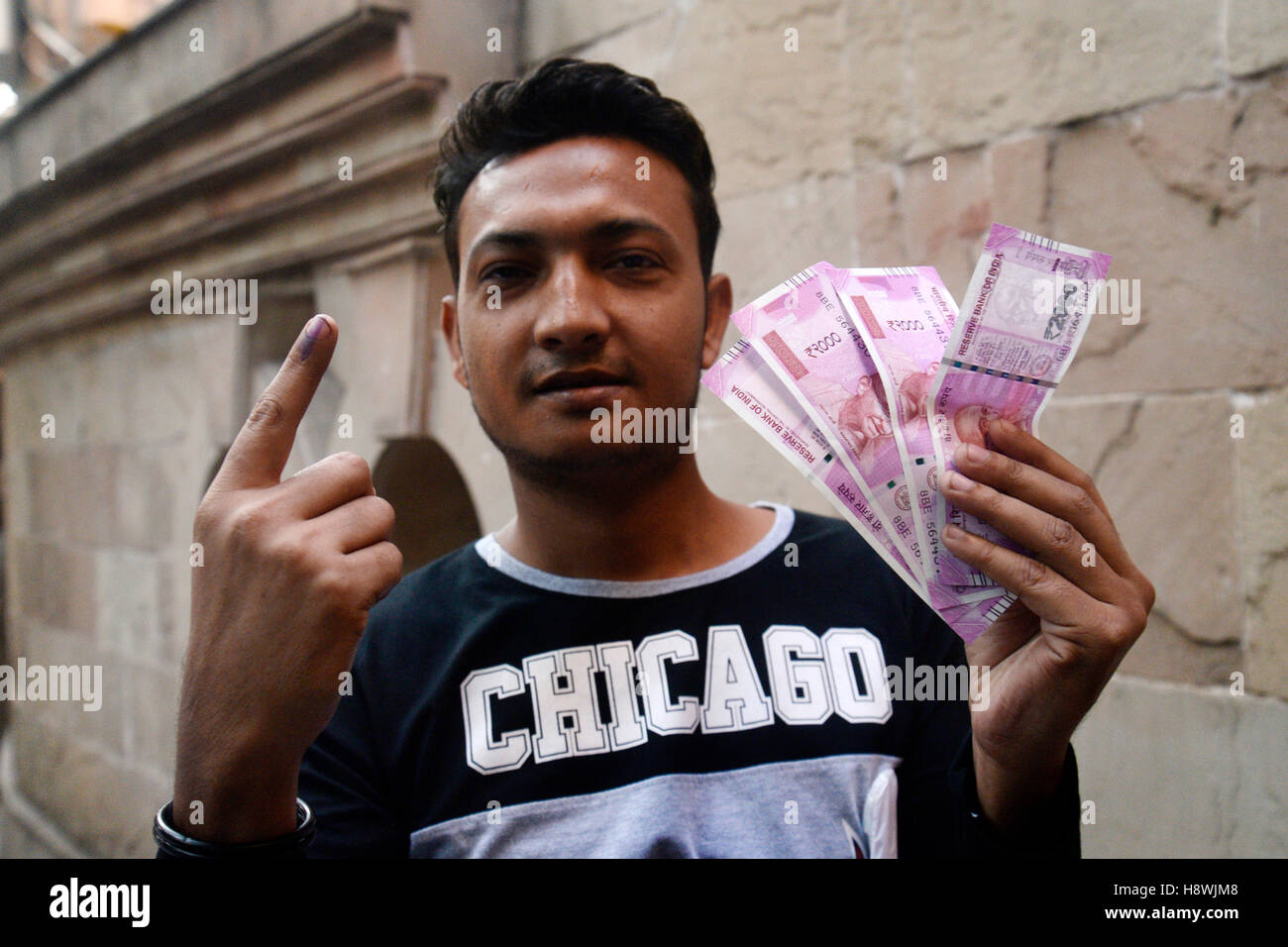 Kolkata, India. 16th Nov, 2016. Indian men display his inked finger and ...