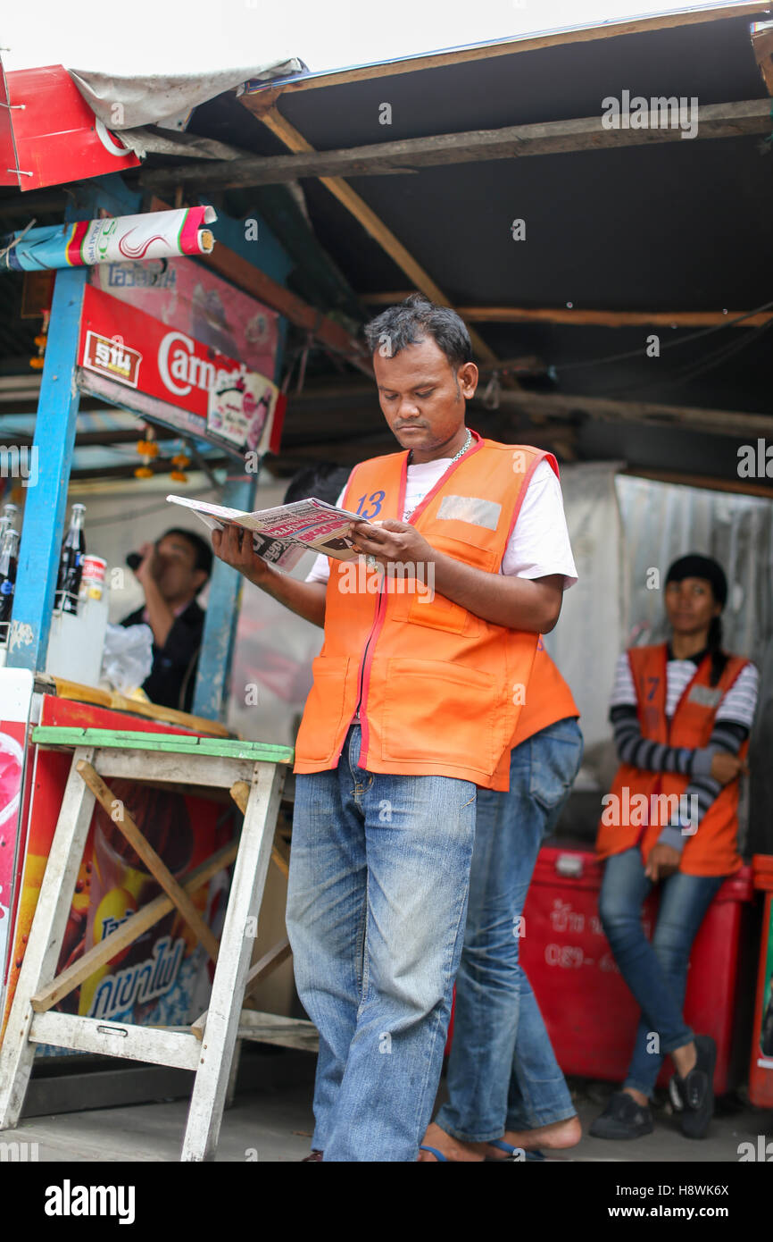 Taxi driver reading newspaper hi-res stock photography and images - Alamy