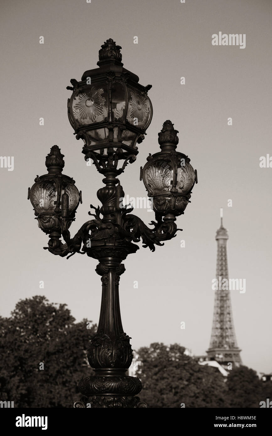 Vintage lamp post and Eiffel Tower on Alexandre III bridge in Paris ...