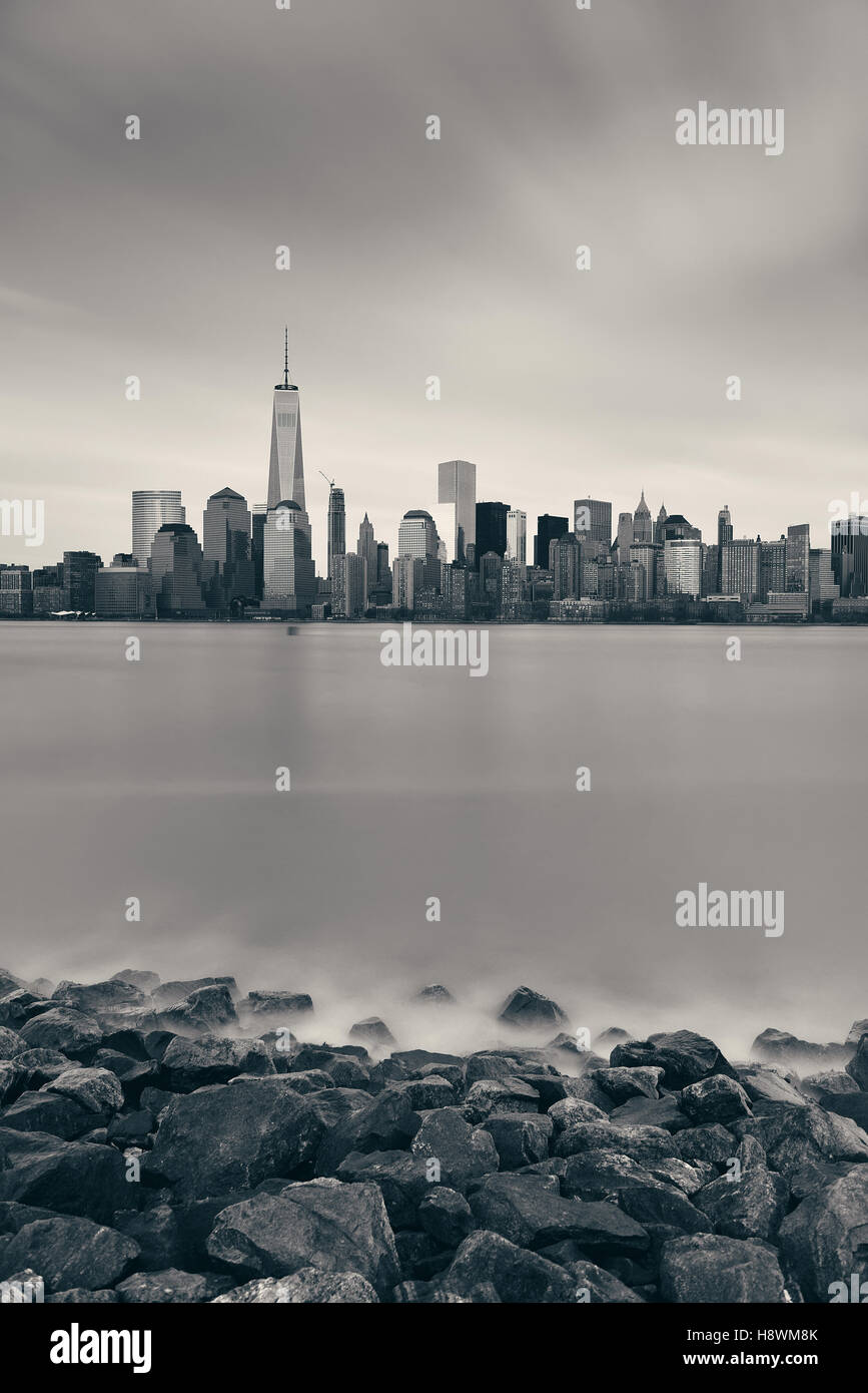 Manhattan downtown skyline with skyscrapers and rock in New York City ...