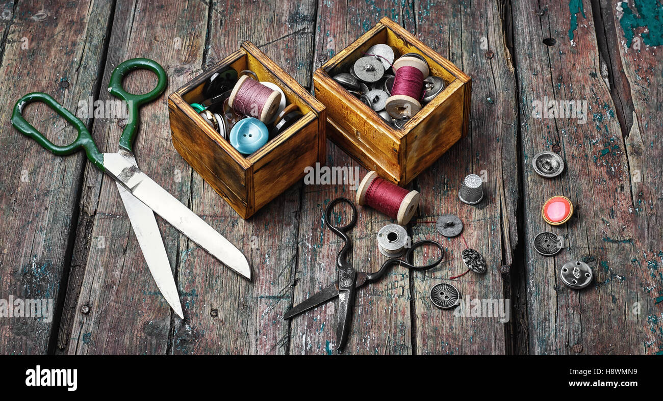 Spools of sewing threads and buttons from clothing Stock Photo - Alamy