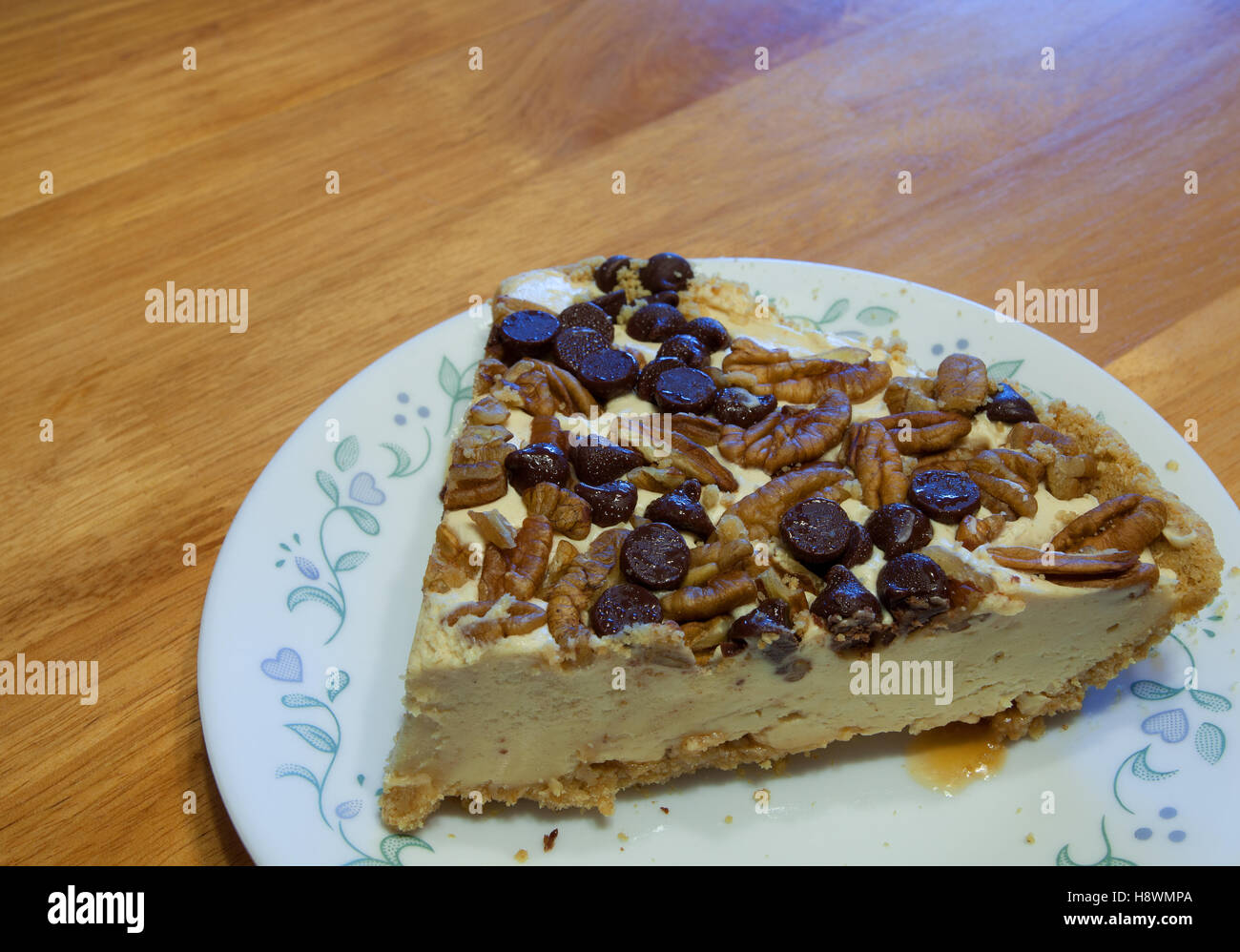 Large piece of cheesecake that is on a white plate Stock Photo - Alamy