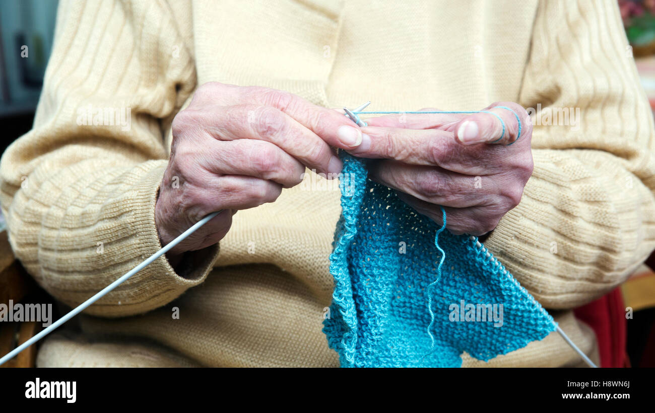 closeup of older woman sitting and knitting Stock Photo - Alamy