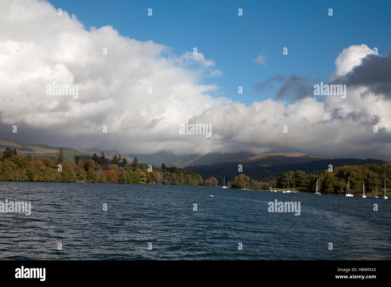 Storm clouds passing across the mountains to the north of Windermere ...