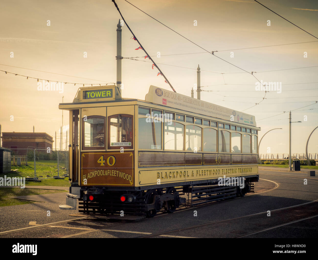 Traditional tram running along seafront promenade, Blackpool ...