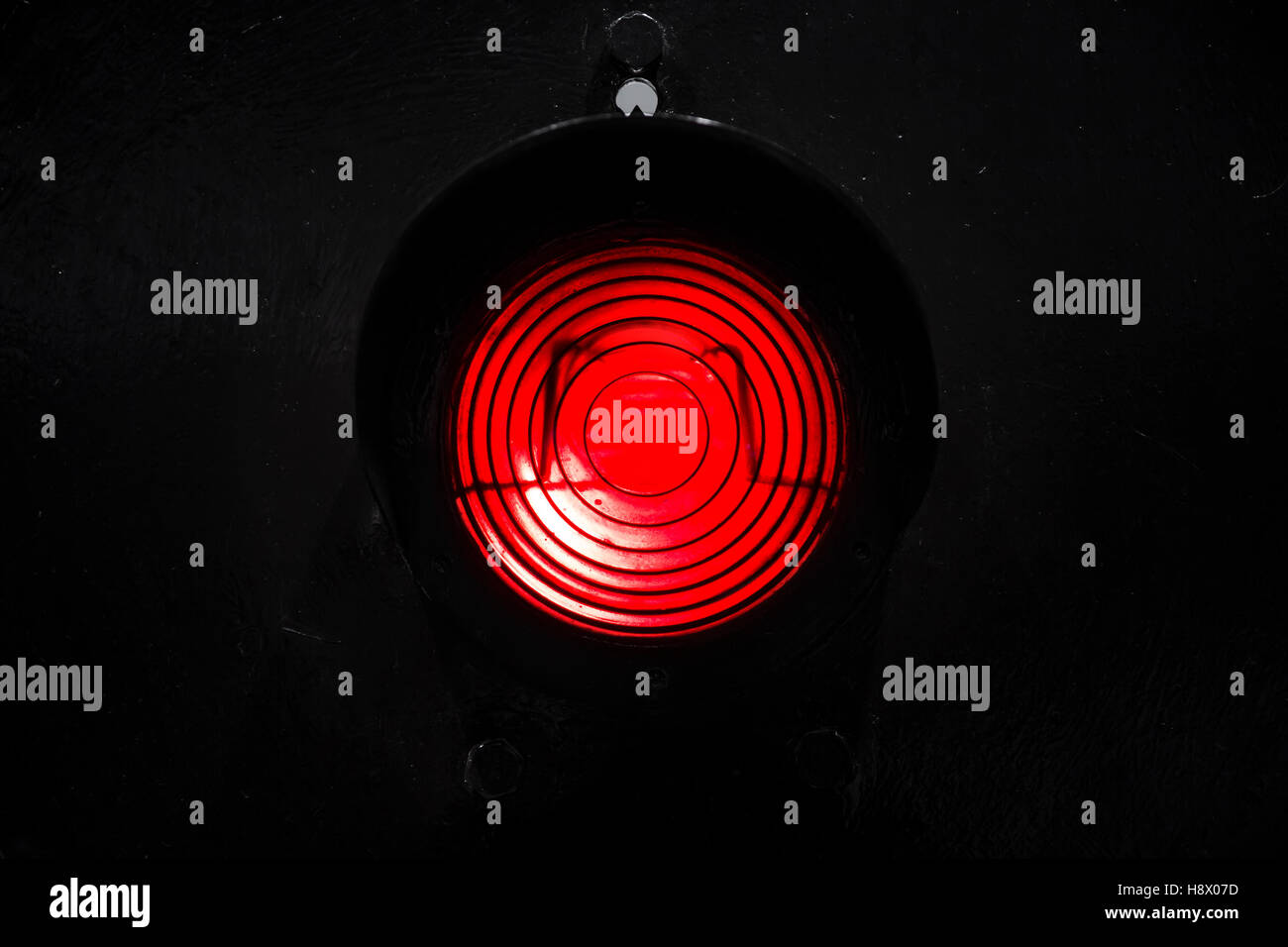 Red traffic light isolated on black background Stock Photo - Alamy
