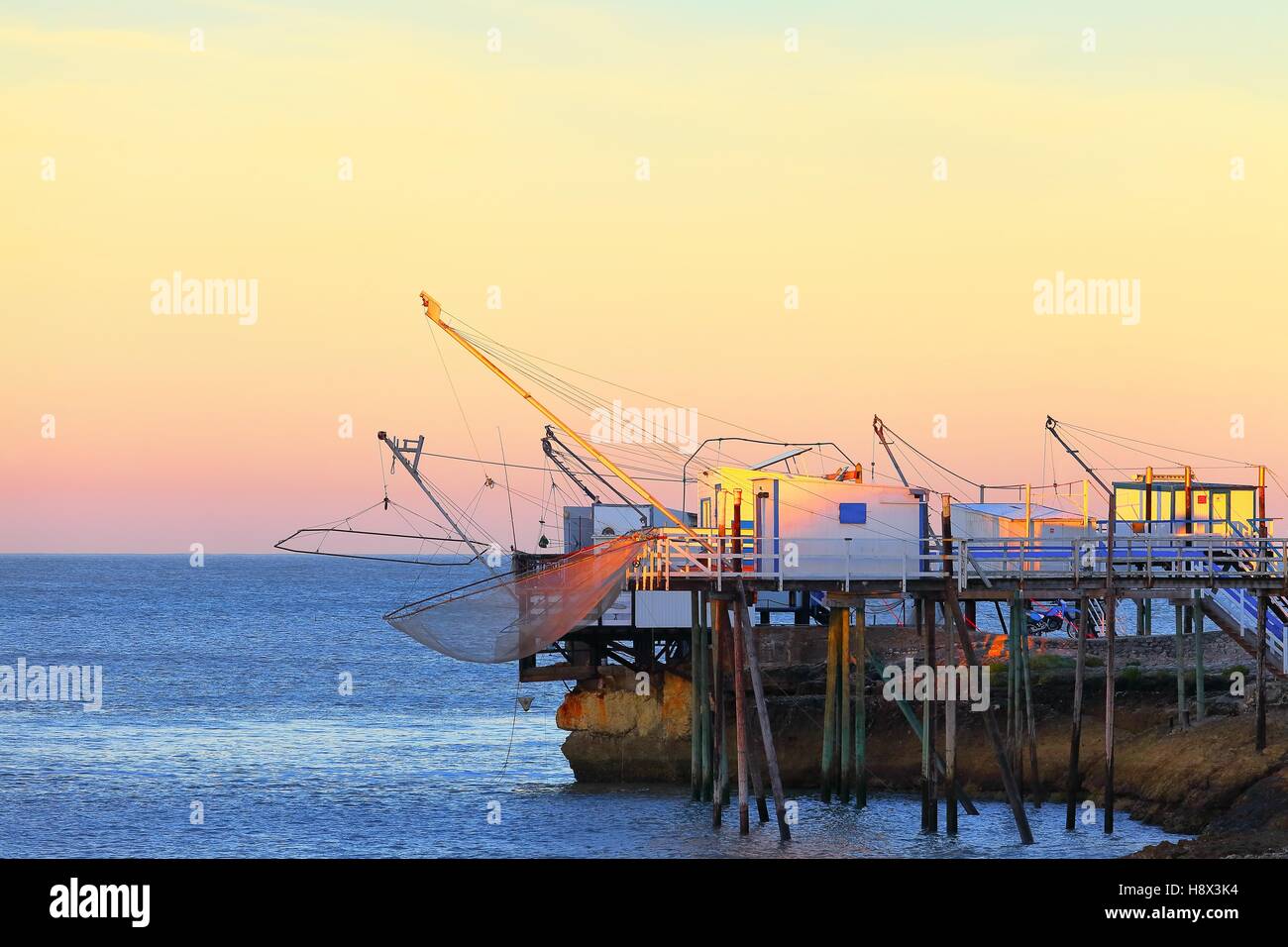 Fisherman hut on stilts for fishing with net with sunset. Saint Palais ...