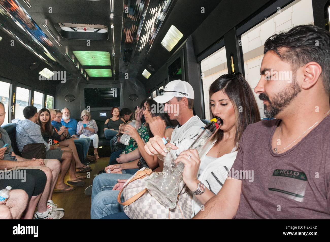 Smoking marijuana on a cannabis bus tour. Denver, CO Stock Photo - Alamy