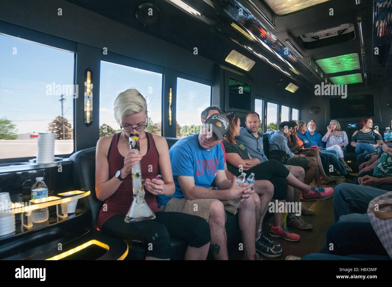 Smoking marijuana on a cannabis bus tour. Denver, CO, USA Stock Photo ...