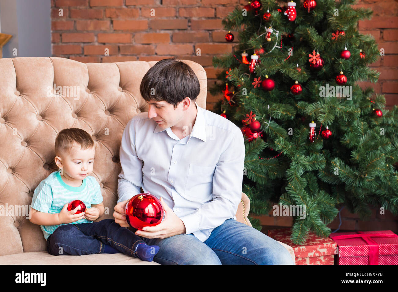 father and son in Christmas home Stock Photo - Alamy