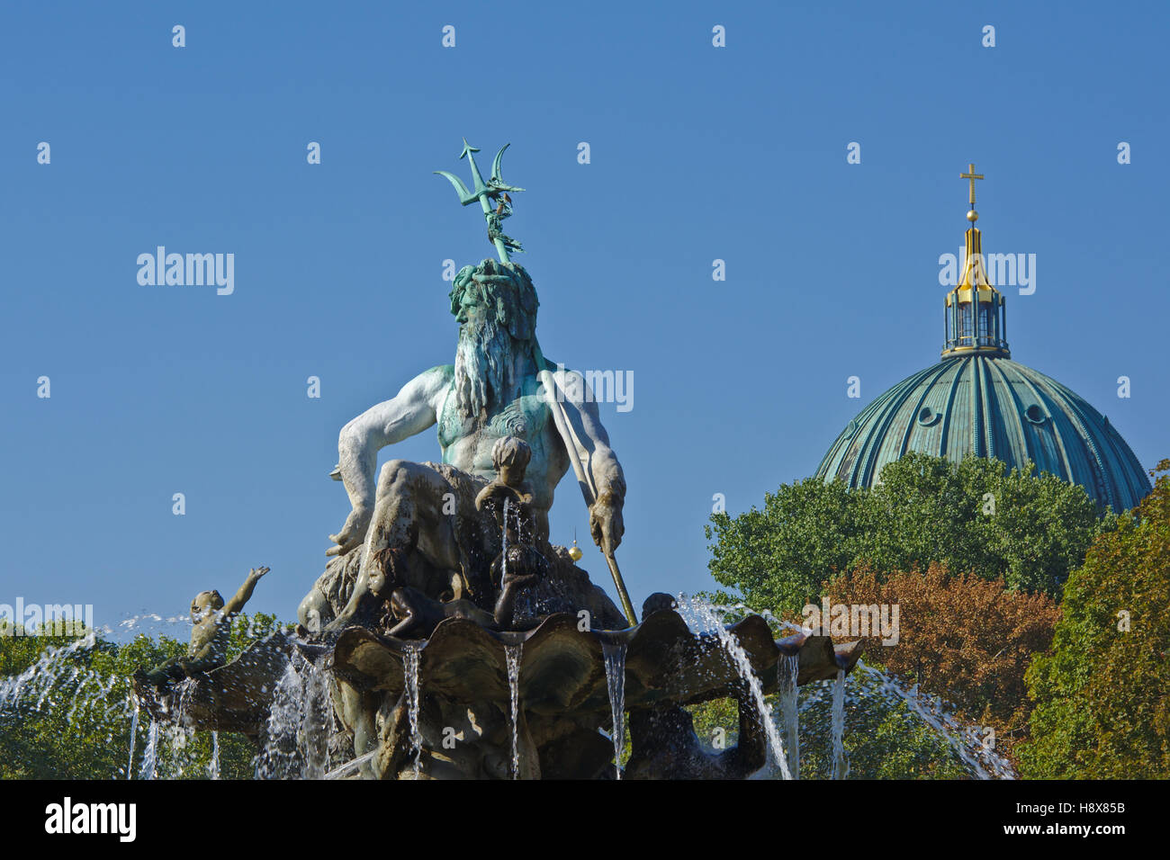 Nepune fountain designed by Reinhold Begas, with the dome of the Berlin ...