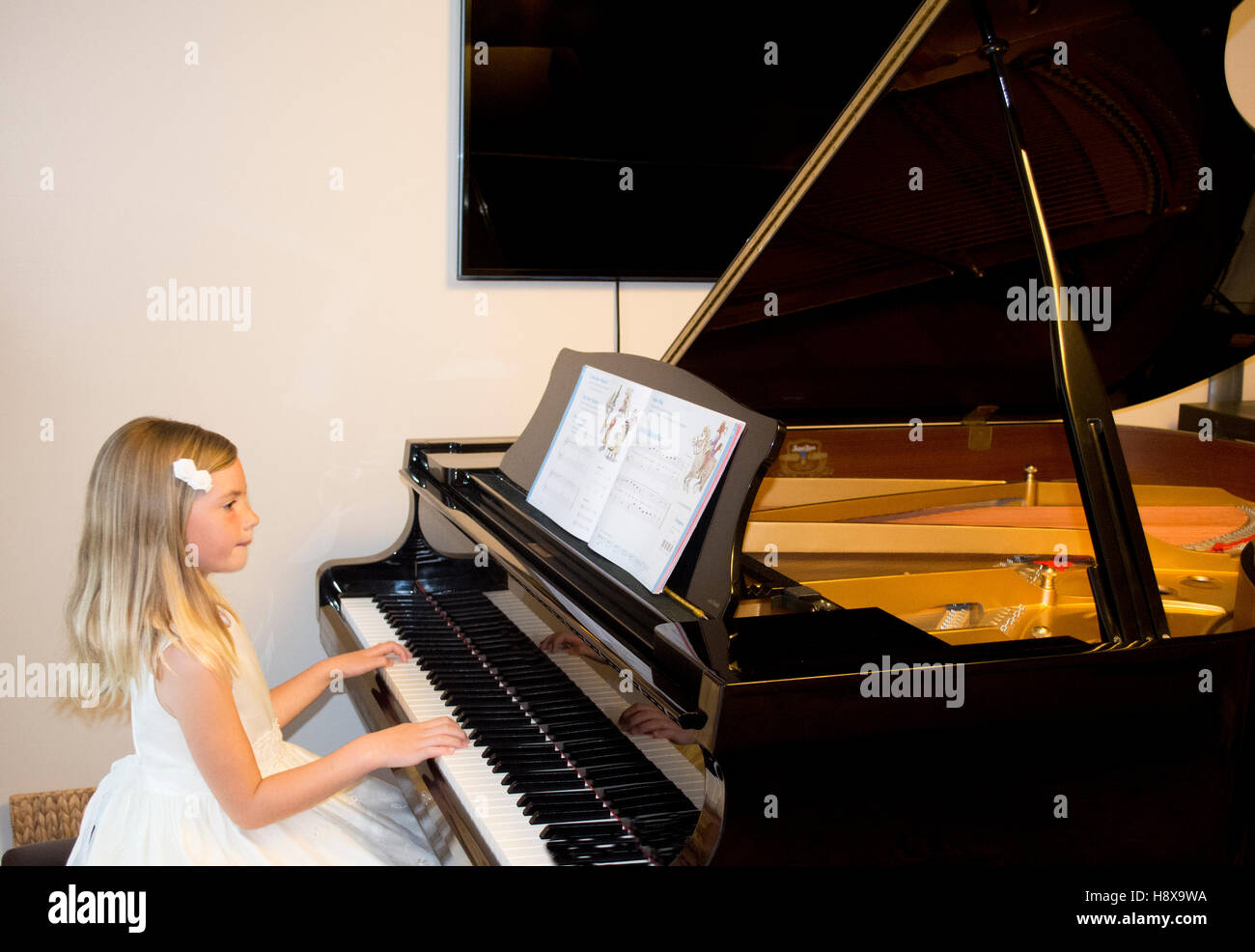 Young Girl Playing Piano Stock Photo - Alamy