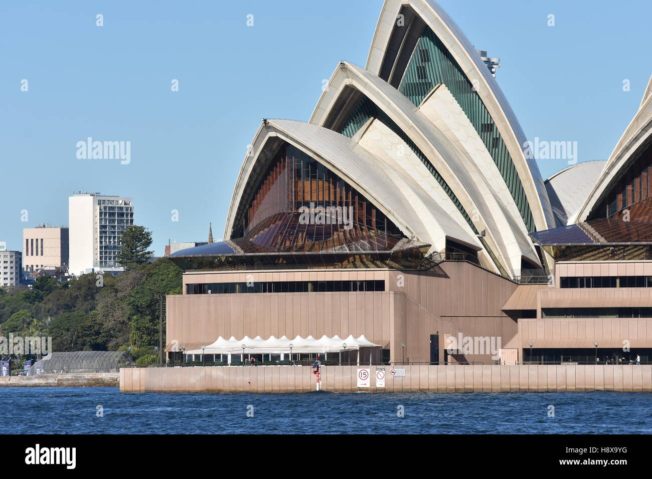 View of iconic Sydney Opera House building from harbour surface ...