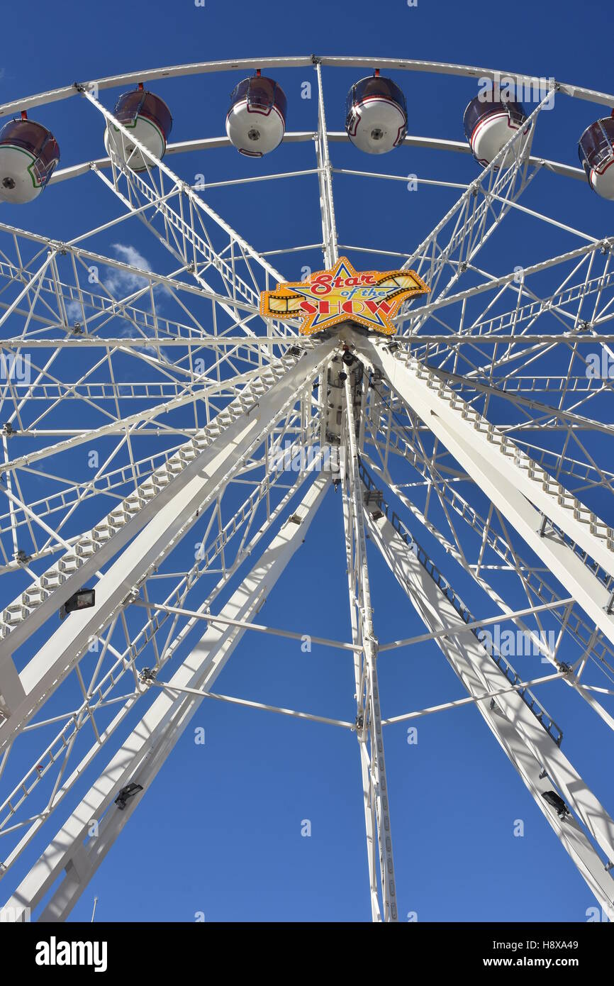 detail of a small ferris wheel against blue sky background Stock Photo ...