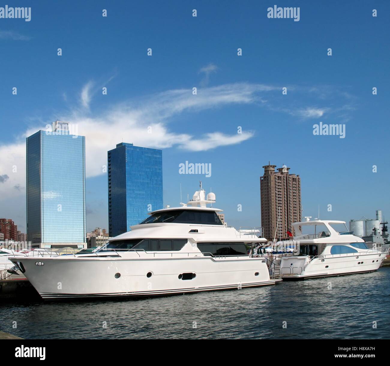 Luxury yachts anchored along the waterfront of Kaohsiung harbor in ...
