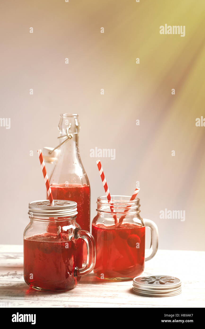 Raspberry drinks in glass cups with drinking straws Stock Photo - Alamy
