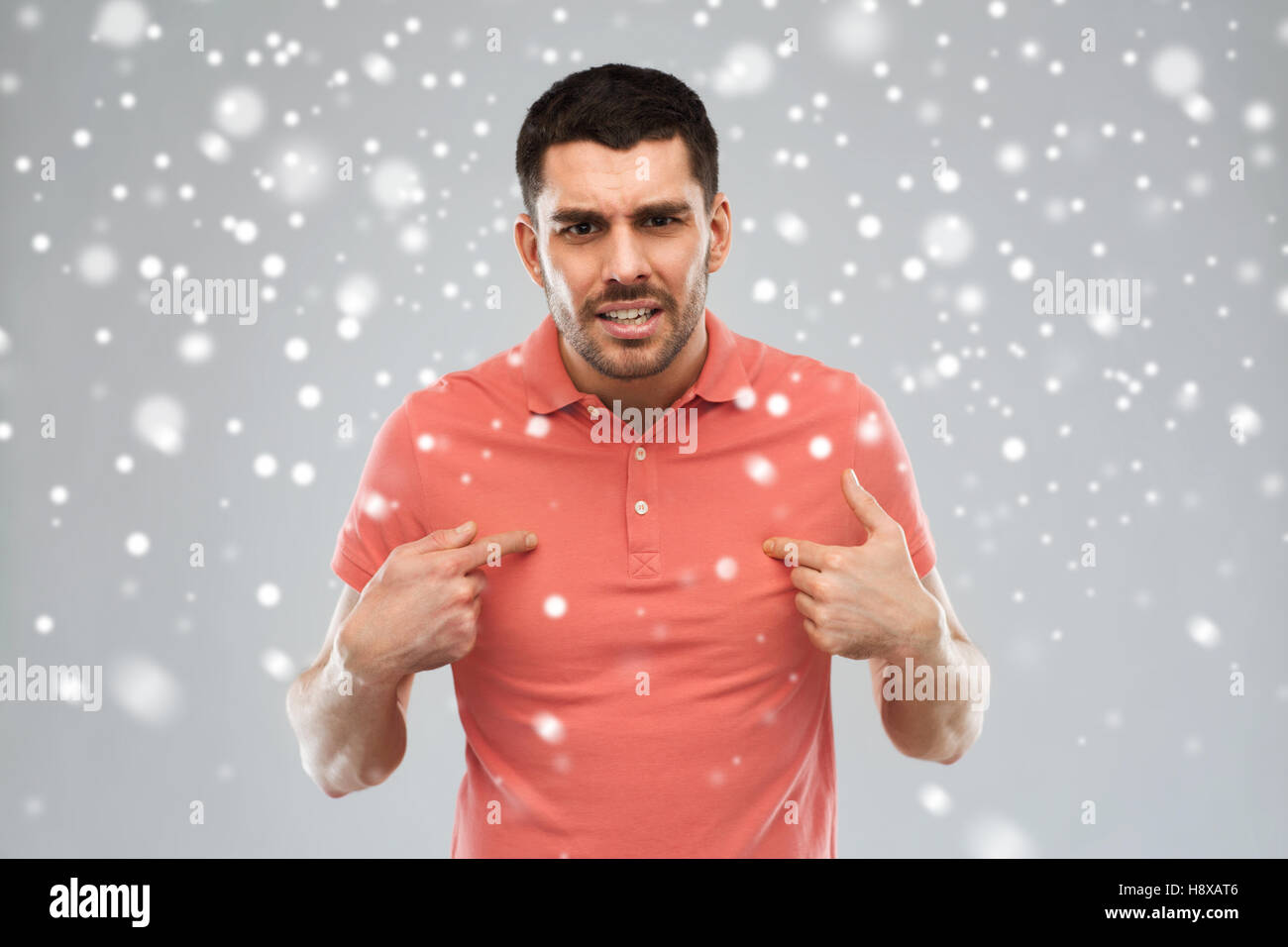 angry man pointing finger to himself over snow Stock Photo - Alamy