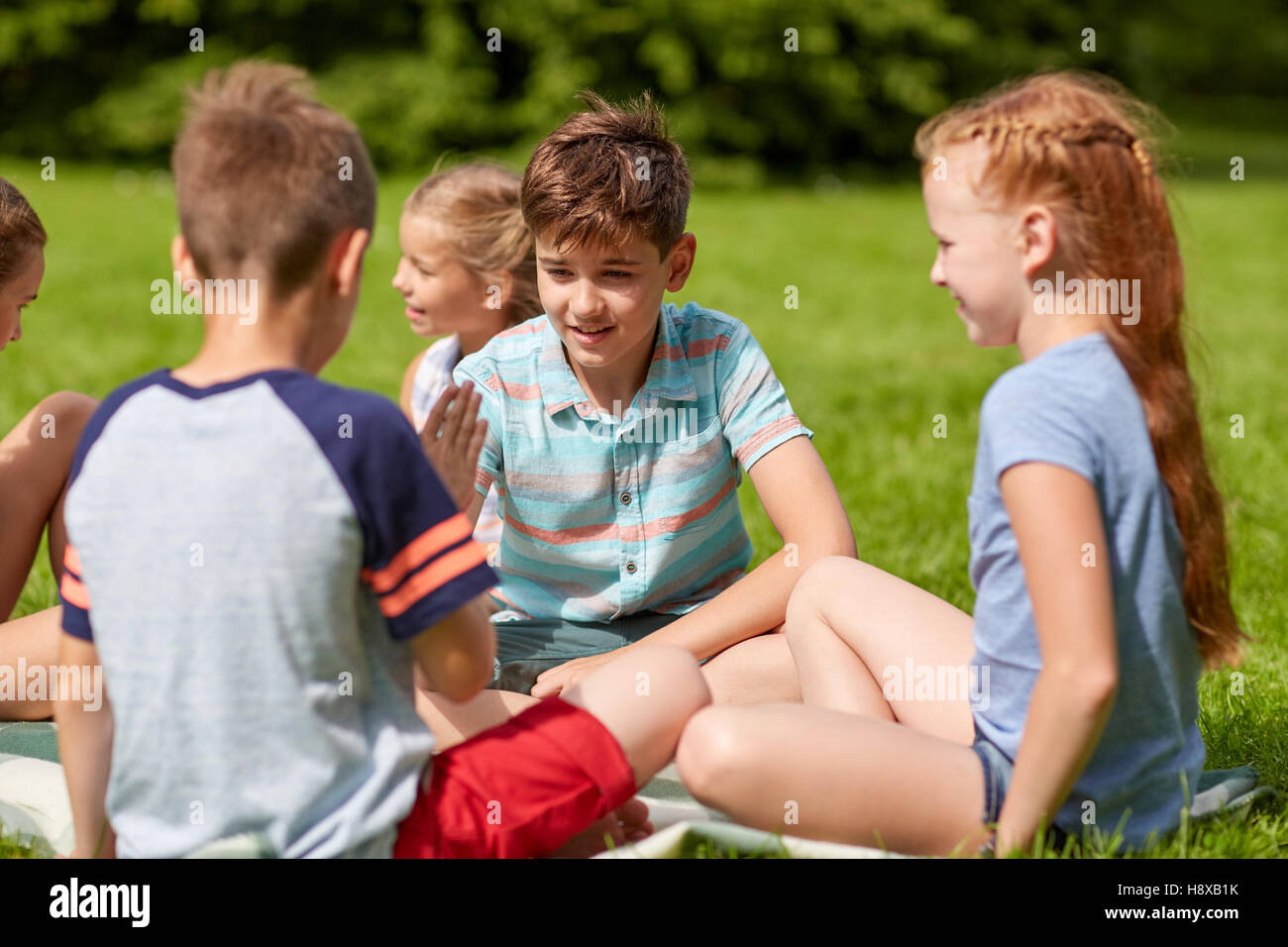 happy kids playing rock-paper-scissors game Stock Photo - Alamy