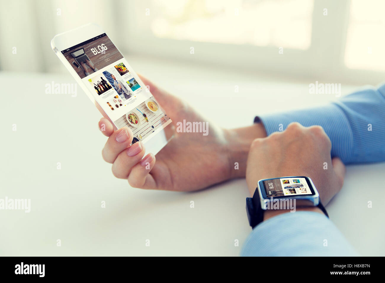close up of hands with smart phone and watch Stock Photo - Alamy