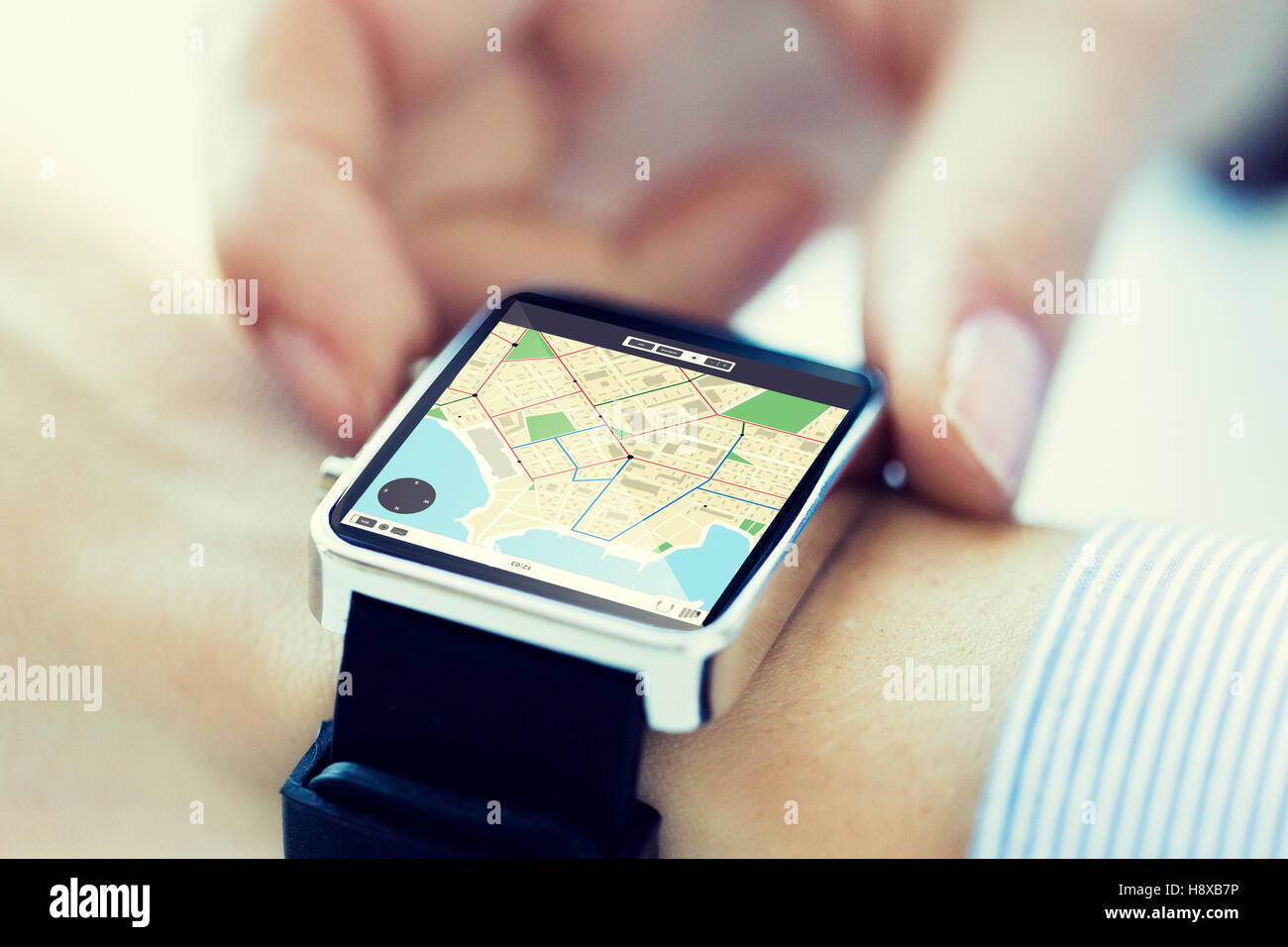 close up of hands with map on smartwatch screen Stock Photo - Alamy