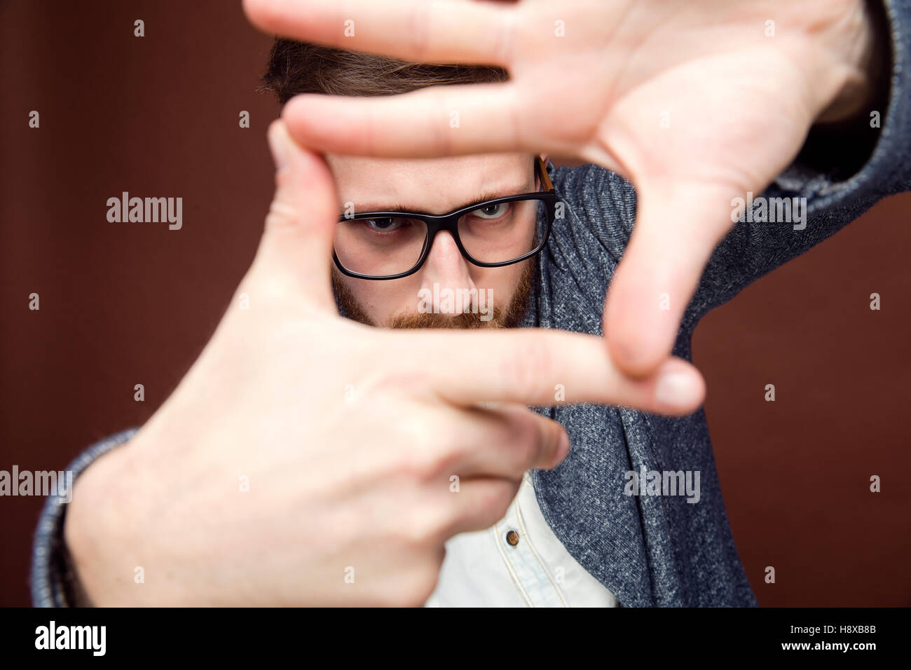 Male making camera from hands Stock Photo - Alamy