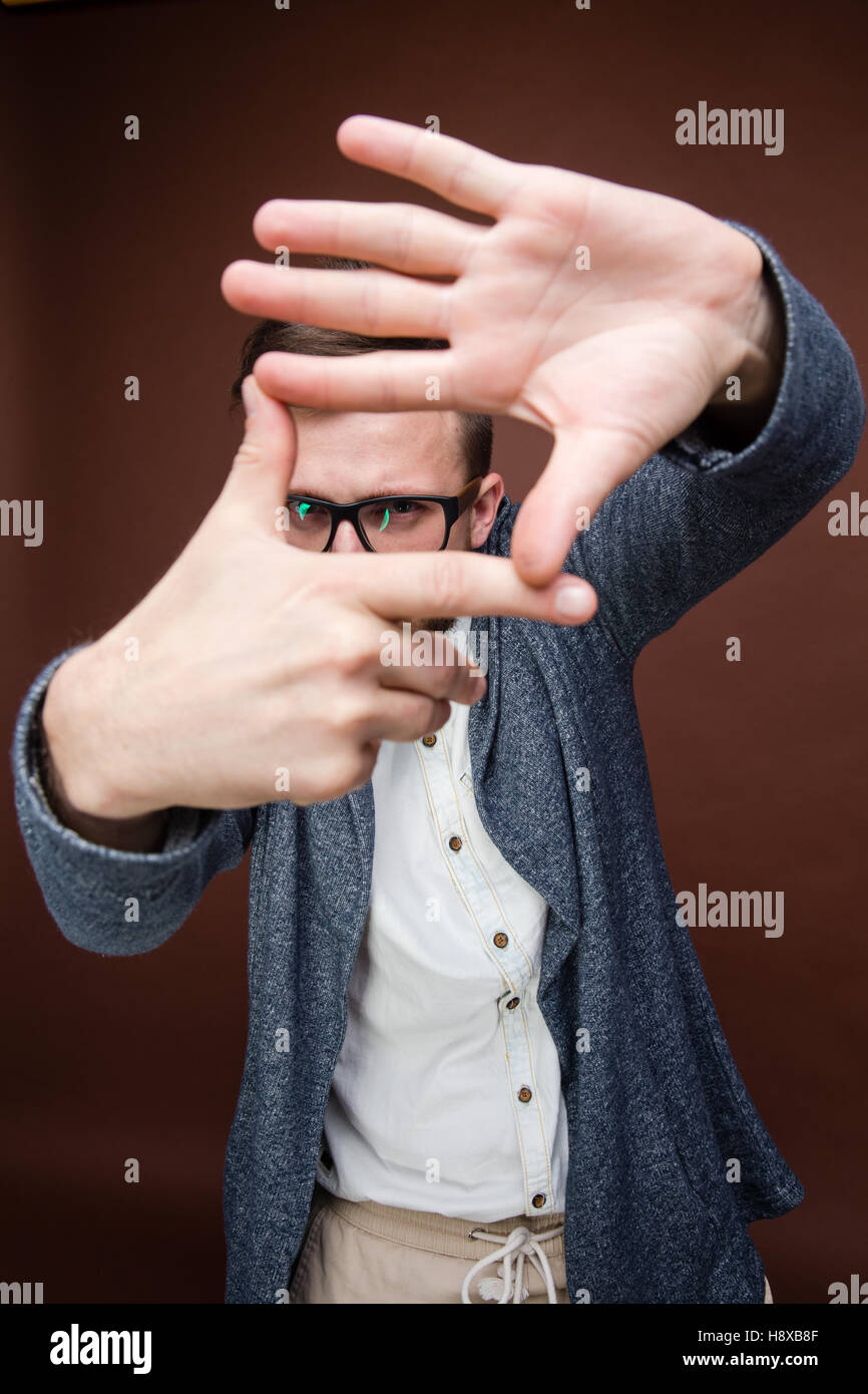 Male making camera from hands Stock Photo - Alamy