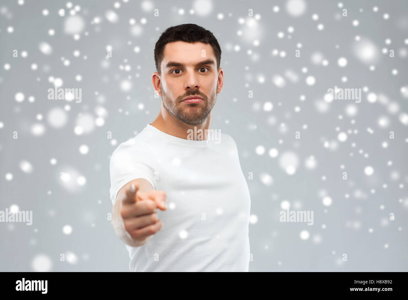 angry man pointing finger to you over snow Stock Photo - Alamy