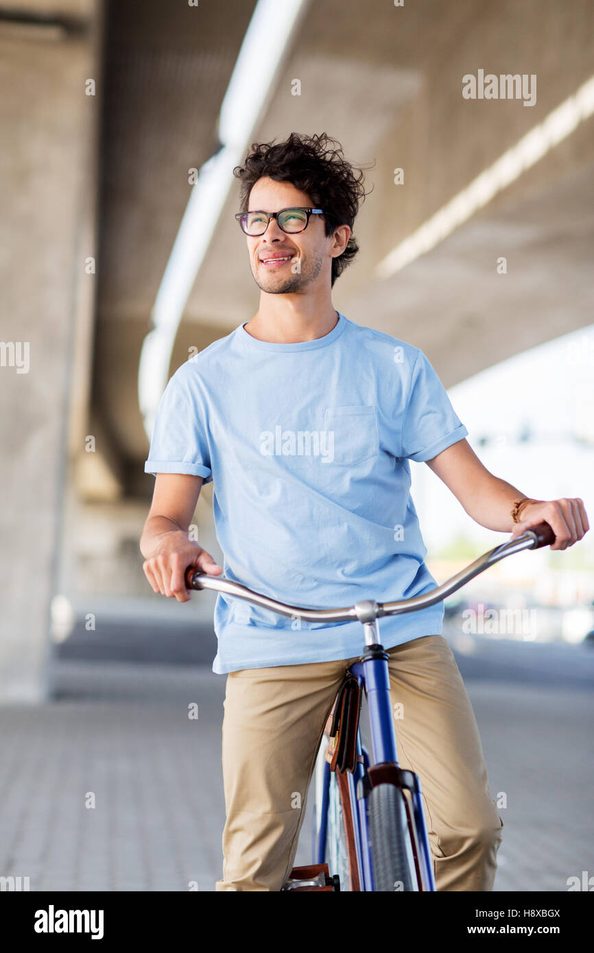 young hipster man riding fixed gear bike Stock Photo - Alamy