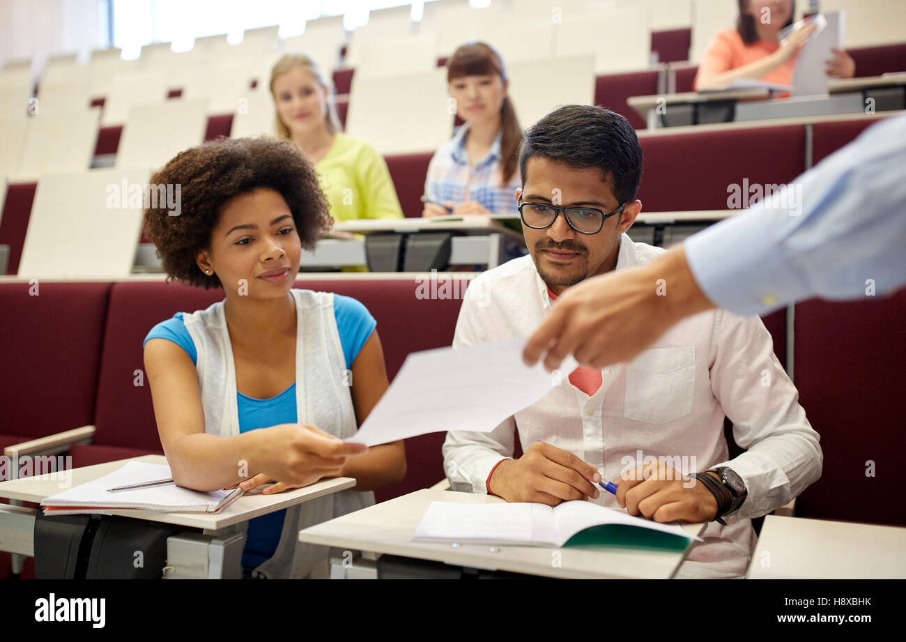teacher giving tests to students at lecture Stock Photo - Alamy