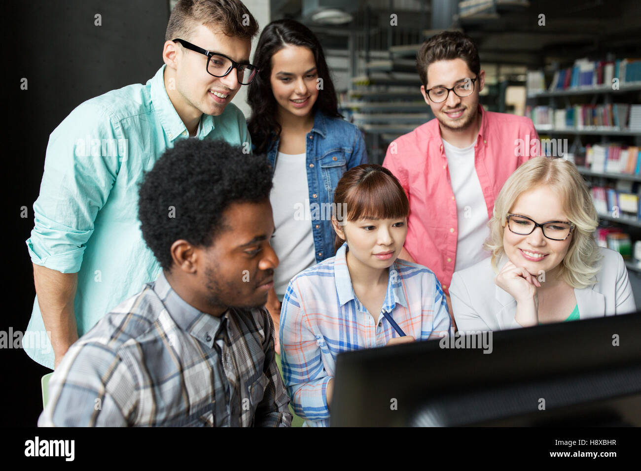 international students with computers at library Stock Photo - Alamy