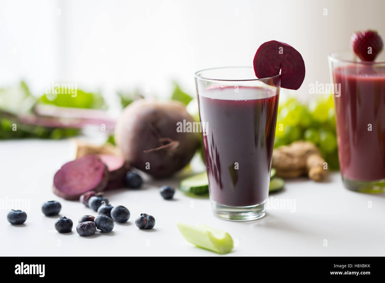 glass of beetroot juice with fruits and vegetables Stock Photo - Alamy