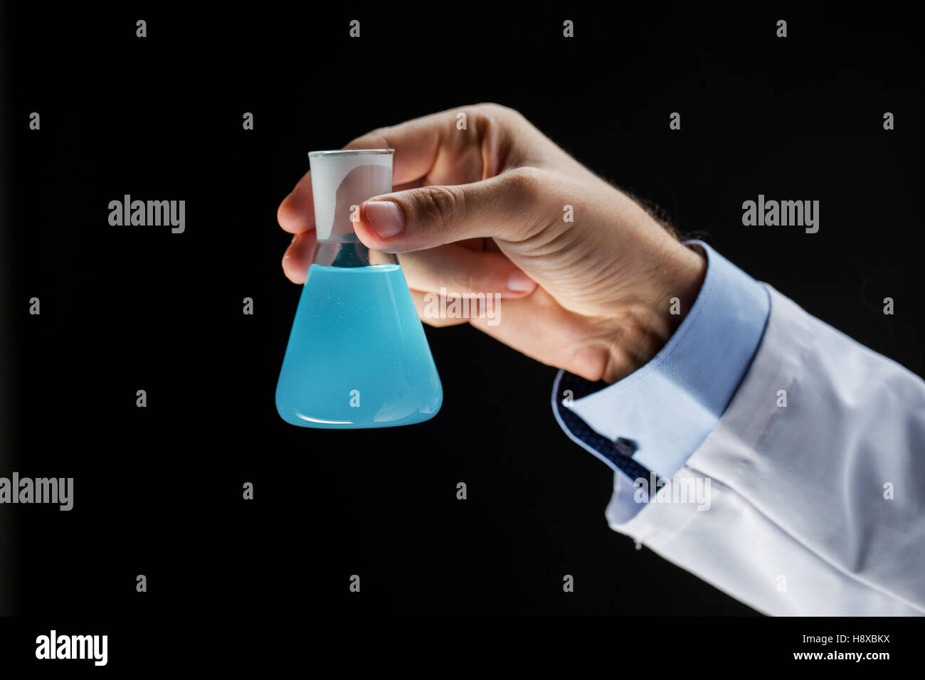 close up of scientist holding flask with chemical Stock Photo - Alamy