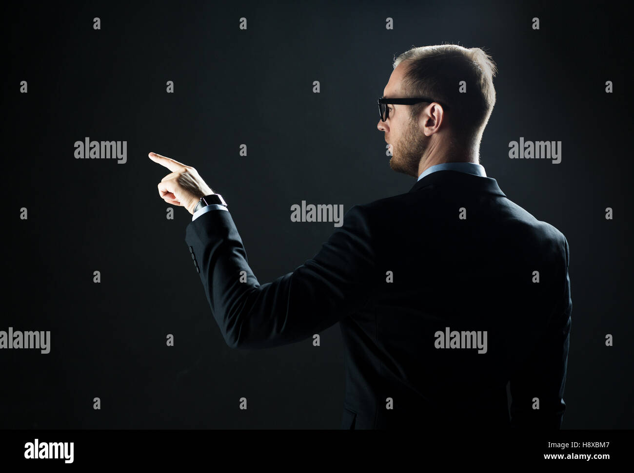 businessman pointing finger to something invisible Stock Photo - Alamy
