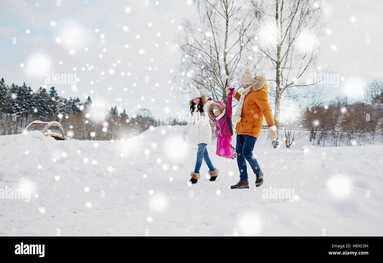 happy family in winter clothes walking outdoors Stock Photo - Alamy