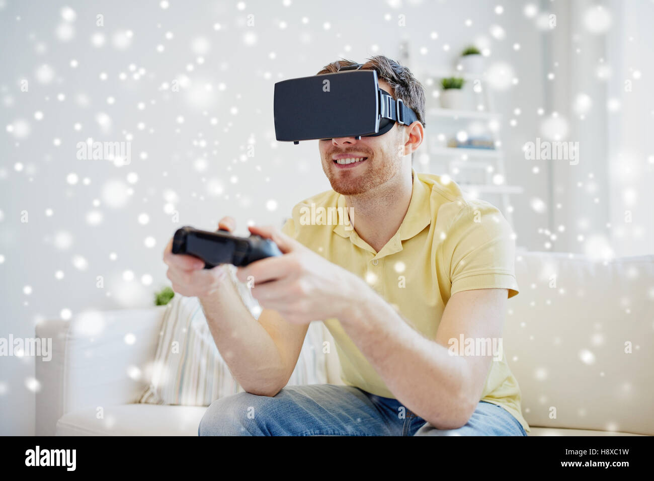 man in virtual reality headset with controller Stock Photo - Alamy