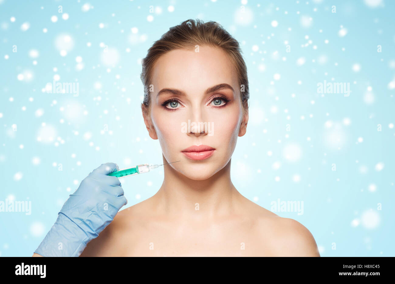 woman face and hand with syringe making injection Stock Photo - Alamy