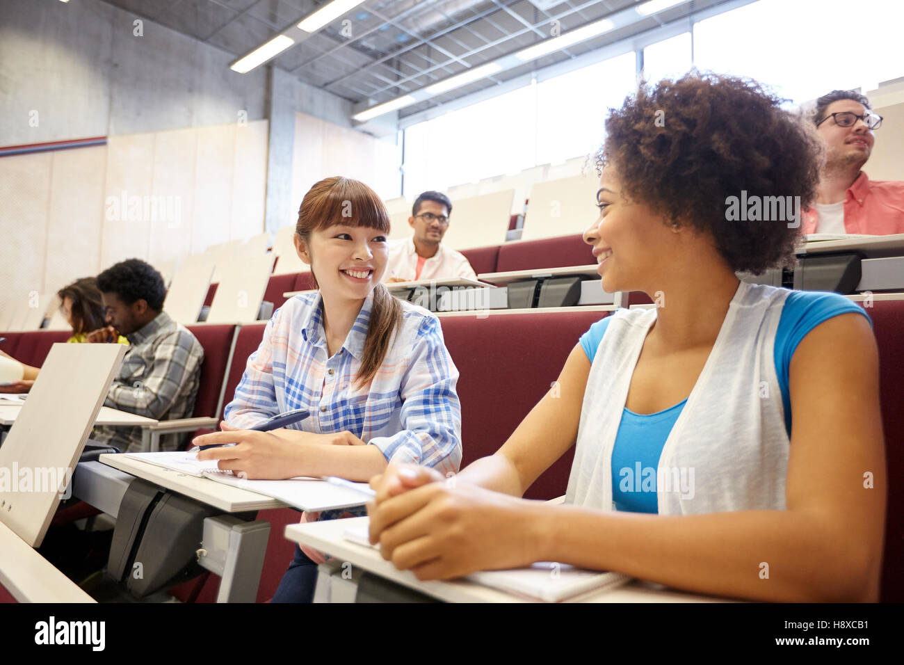 group of international students talking on lecture Stock Photo - Alamy
